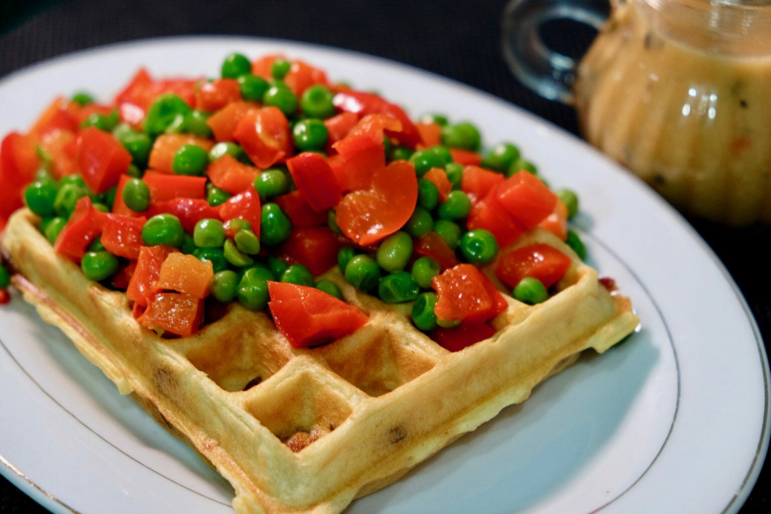 Chinese sausage waffles with a warm pea and red pepper salad - delectabilia