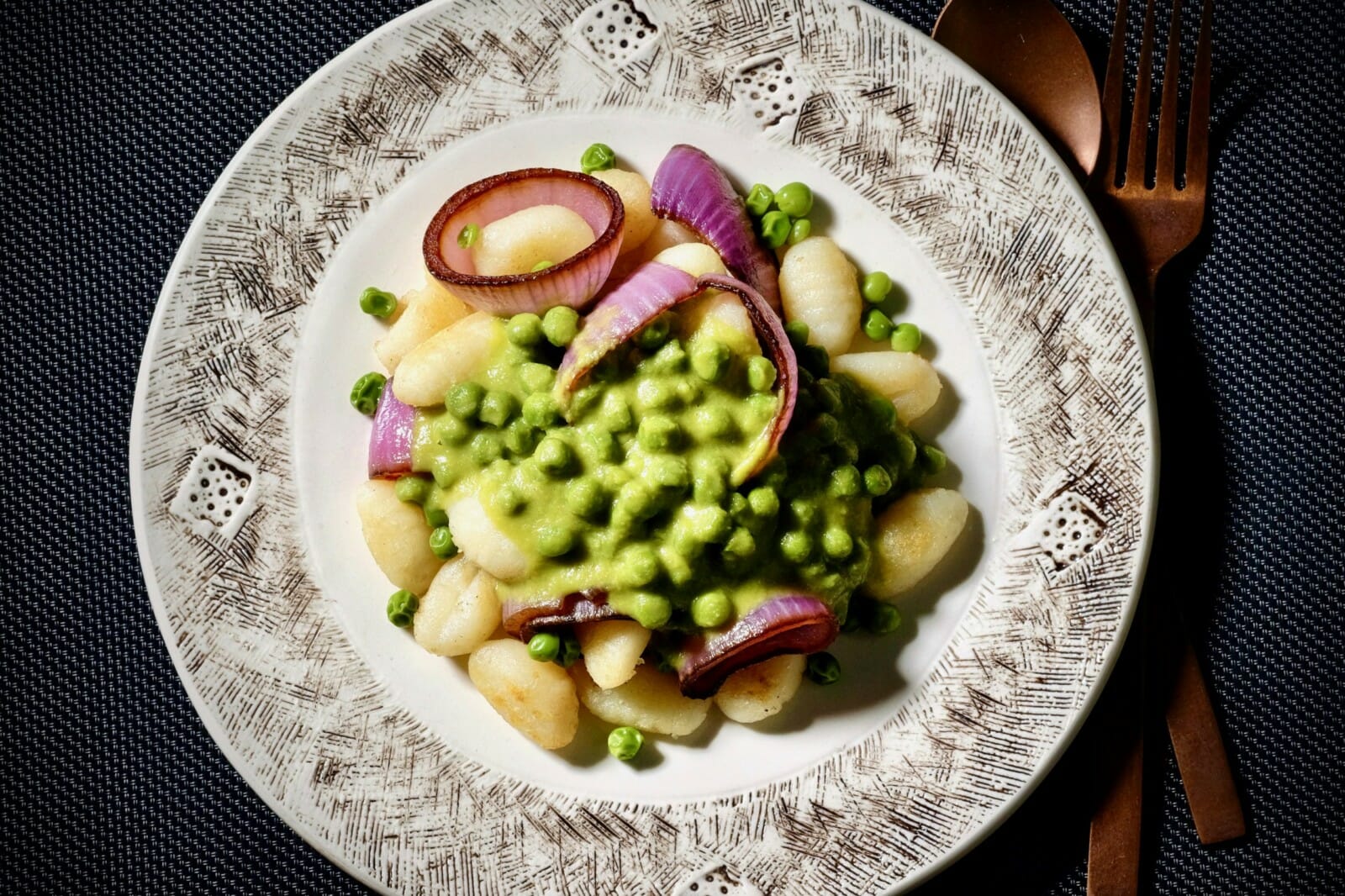 Seared gnocchi with miso peas and charred red onion - delectabilia