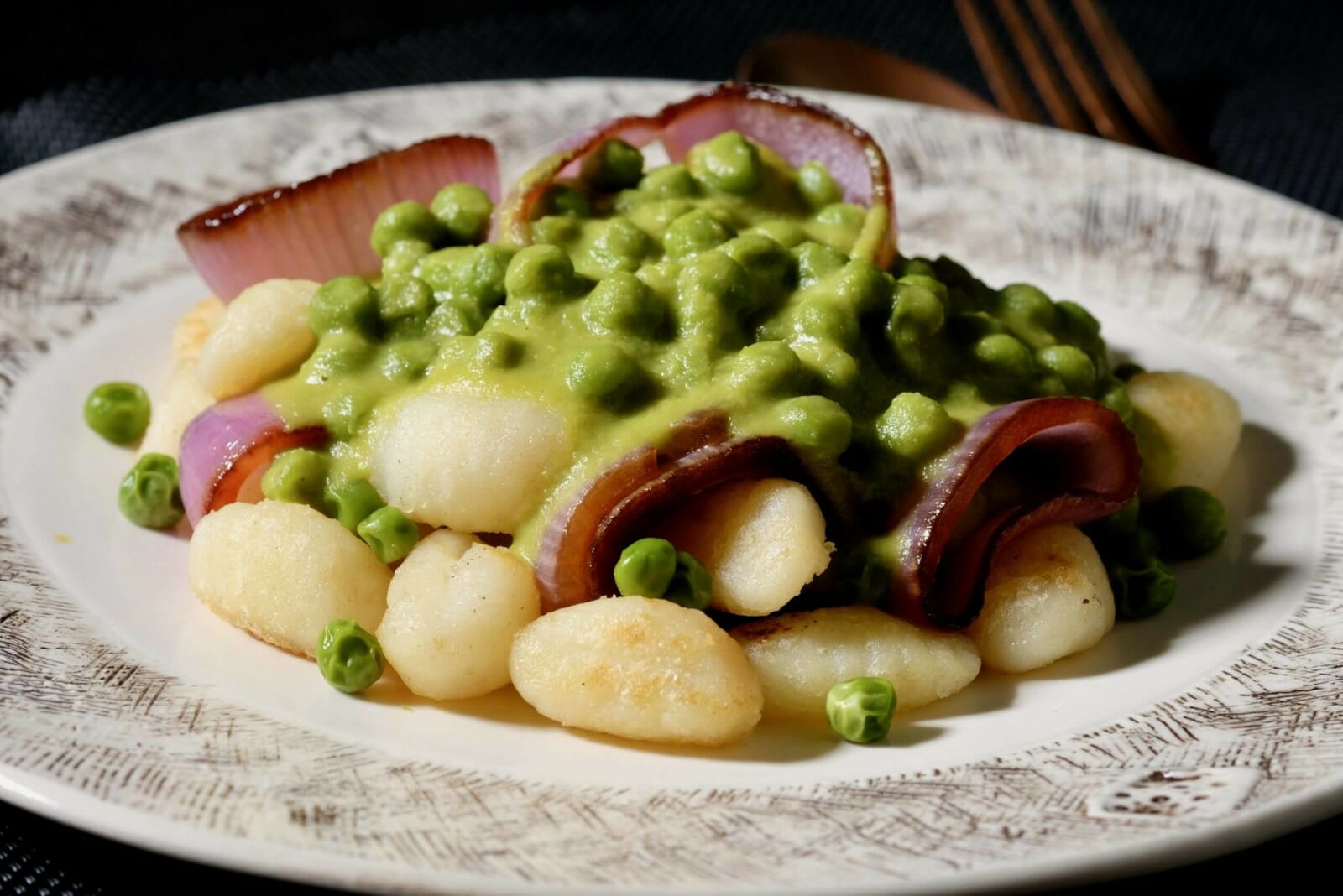 Seared gnocchi with miso peas and charred red onion - delectabilia