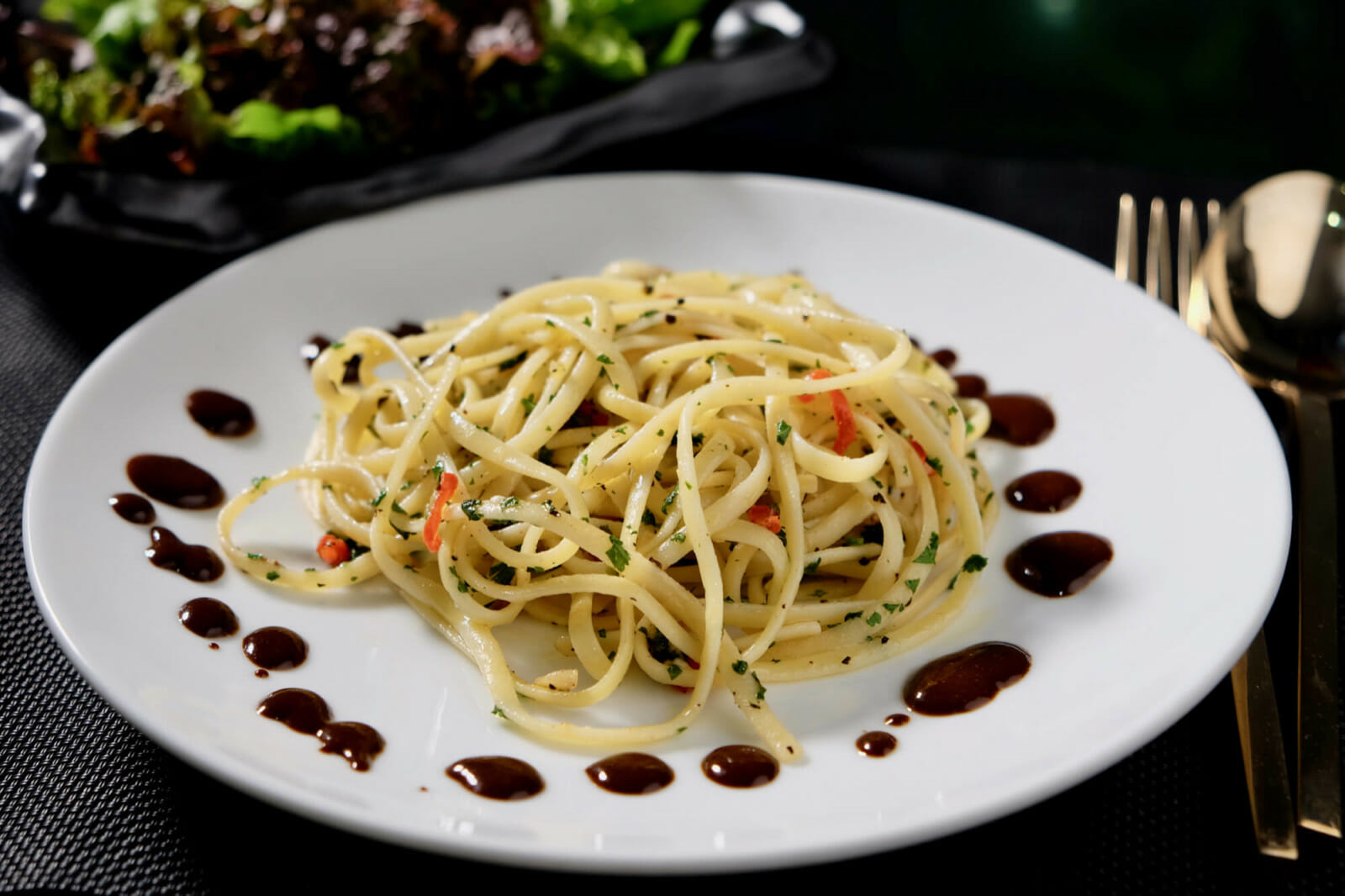 Pasta with anchovies and garlic. Black garlic and balsamic drizzle ...
