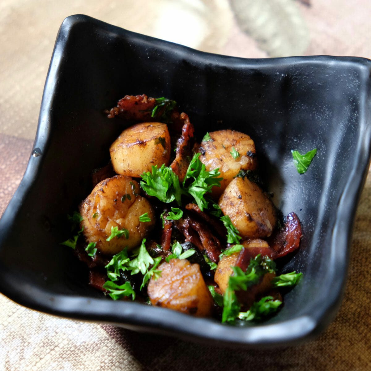 Scallops, chorizo, black garlic, and sake - delectabilia
