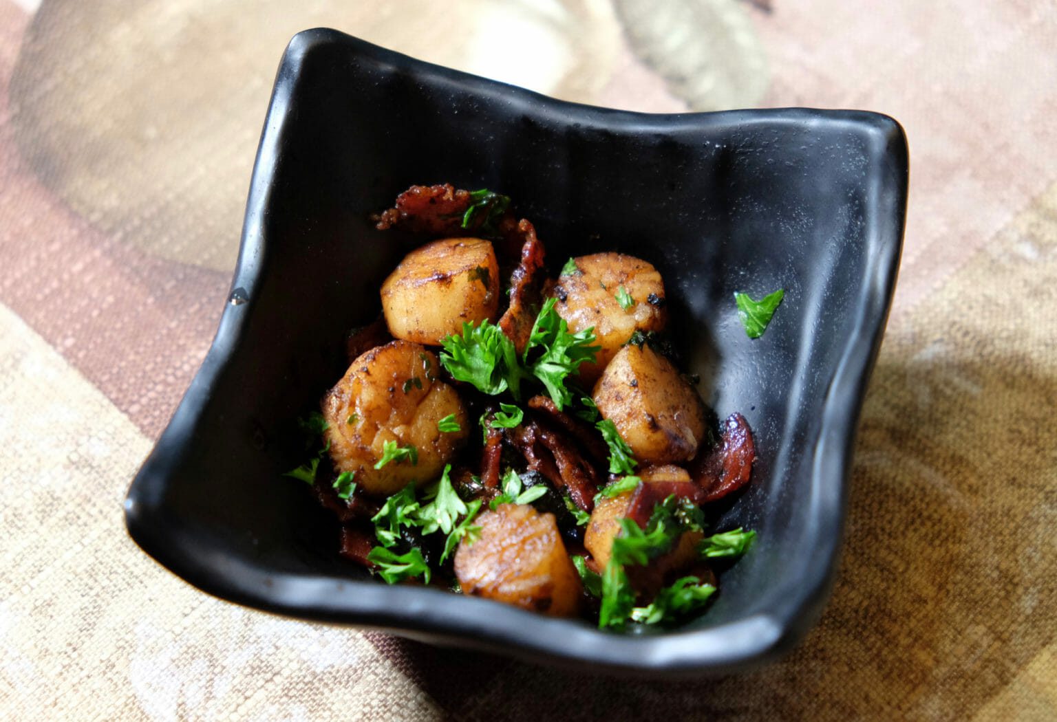 Scallops, chorizo, black garlic, and sake - delectabilia