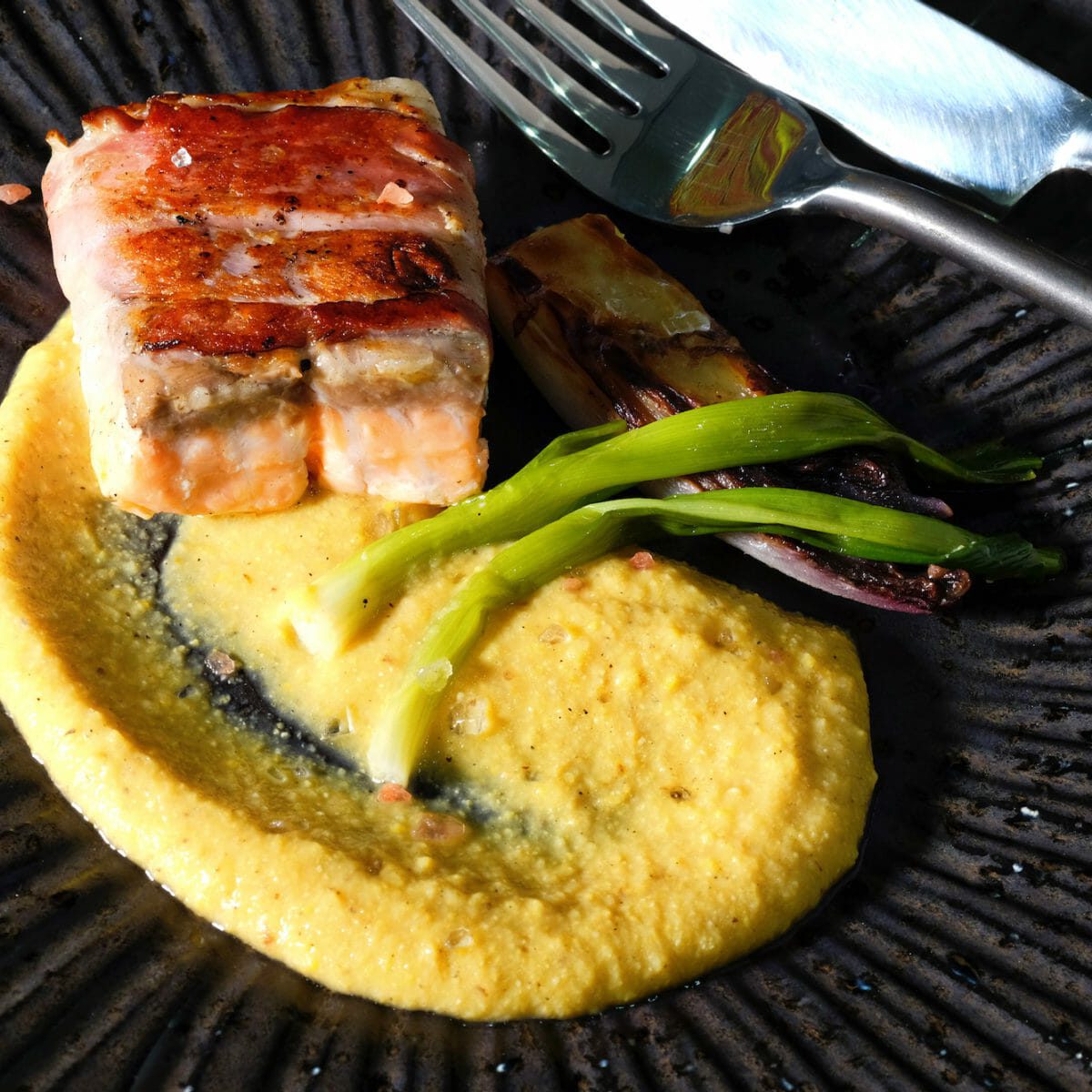 Salmon wrapped in bacon with charred corn puree - delectabilia
