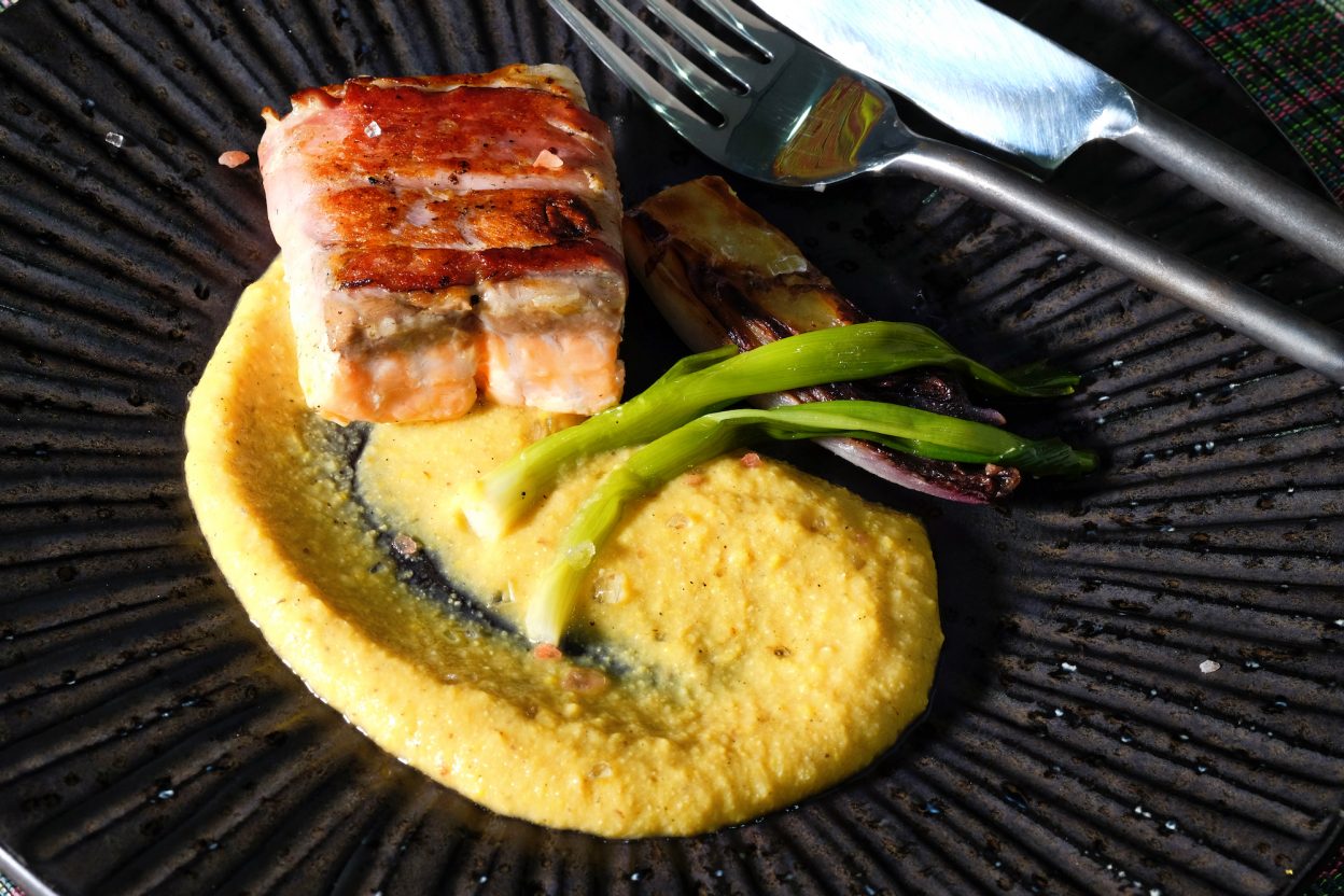 Salmon wrapped in bacon with charred corn puree - delectabilia